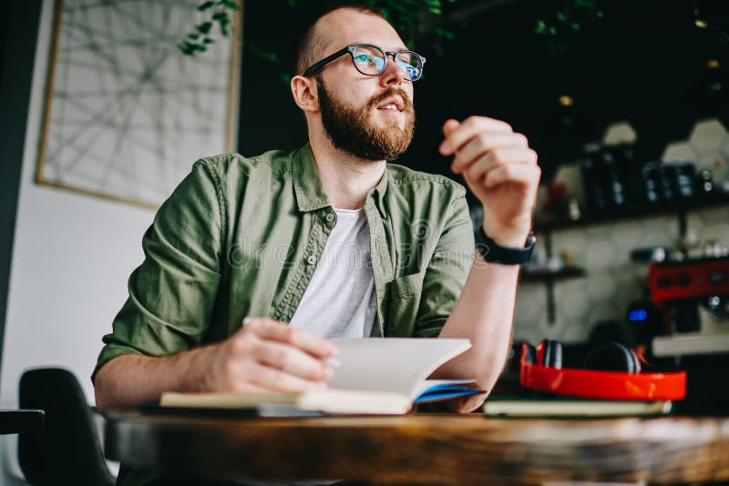 Handsome Creative Author Sitting at Cafe Interior with Notebook Stock ...