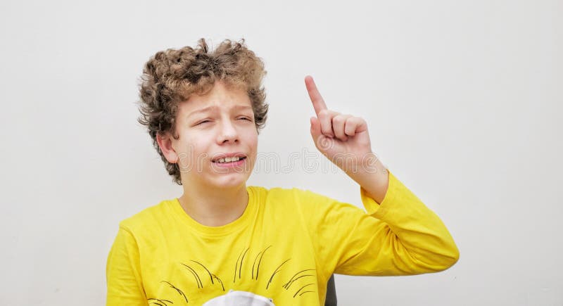 Handsome Curly Guy Smiling with Idea or Question, Pointing with Finger ...