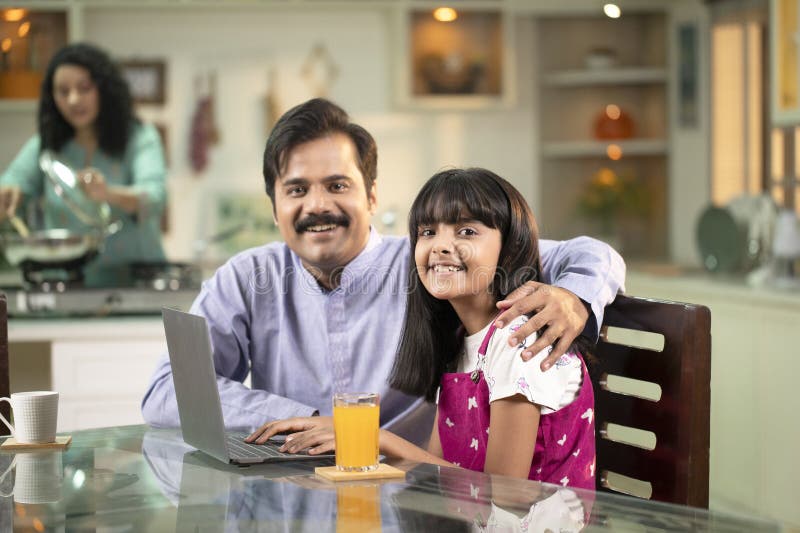Handsome Daddy and Daughter Sitting at Dining Table while Posing in ...