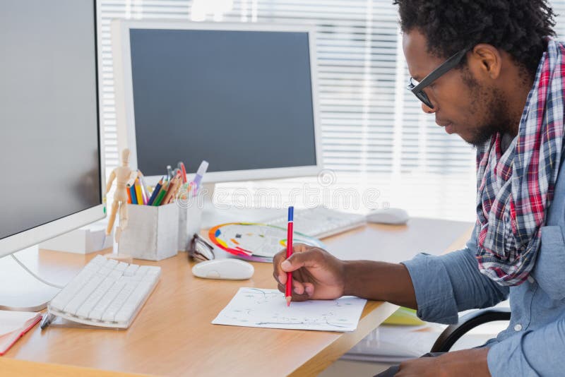 Handsome Designer Drawing Something with a Red Pencil Stock Image ...