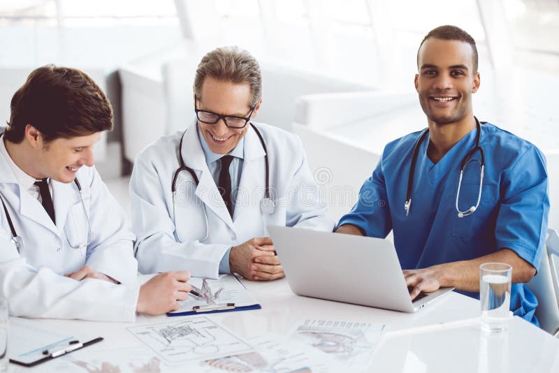 Handsome doctors working stock photo. Image of health - 86583486