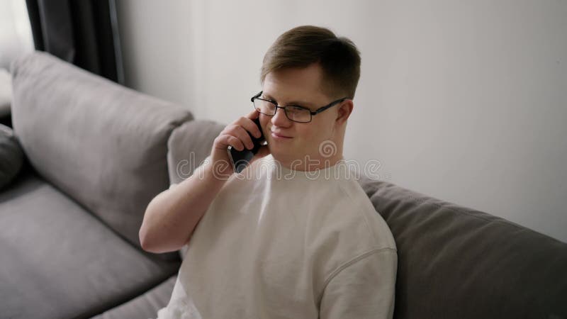 Down Syndrome Man Sitting on Floor at Home and Playing with Rubik Cube ...