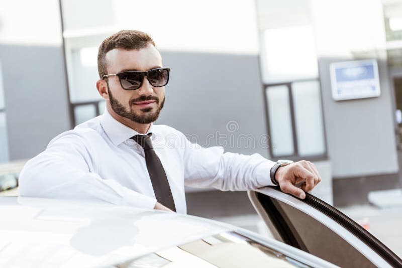 Handsome Driver in Sunglasses Standing Near Car and Looking Stock Image ...