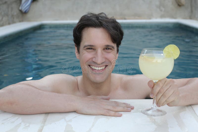 Handsome Dude Drinking a Cocktail in the Pool Stock Photo - Image of ...