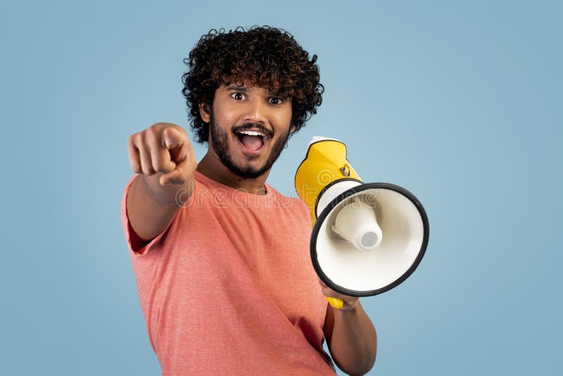 Handsome Eastern Guy Shouting through Loudspeaker and Gesturing Stock ...