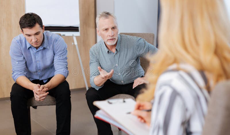 Handsome Elderly Man Looking at His Therapist Stock Photo - Image of ...