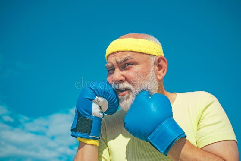 Handsome Elderly Man Practicing Boxing Kicks. Active Leisure. Senior ...
