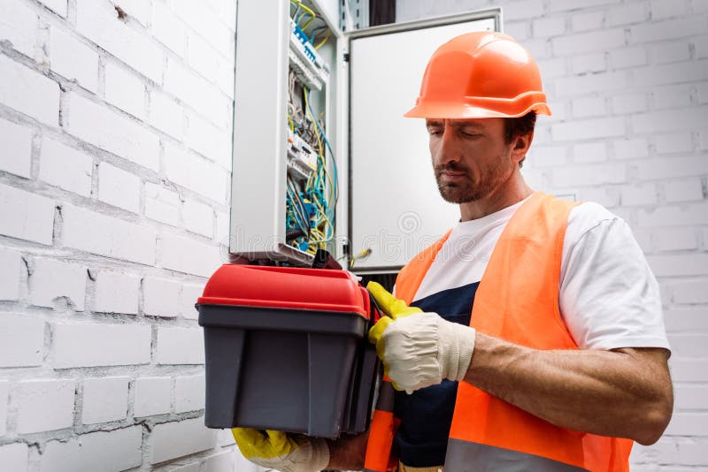 Electrician Holding Toolbox Near Electrical Distribution Stock Photo ...