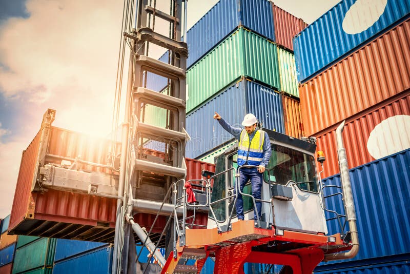 Handsome Engineer or Foreman Wears PPE Checking Container Storage with ...