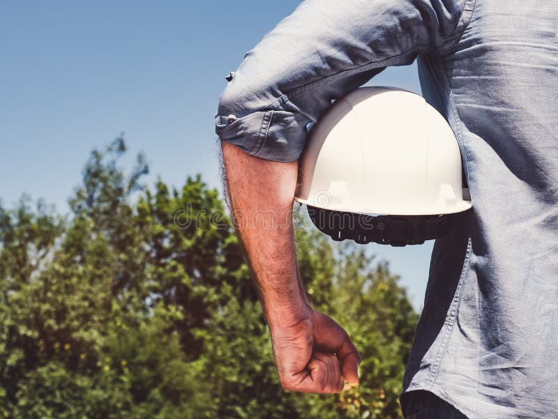 Engineer, Holding White Hardhat in the Park Stock Image - Image of ...