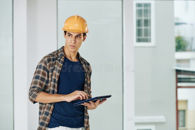 Handsome Engineer at Work stock photo. Image of handsome - 187348996