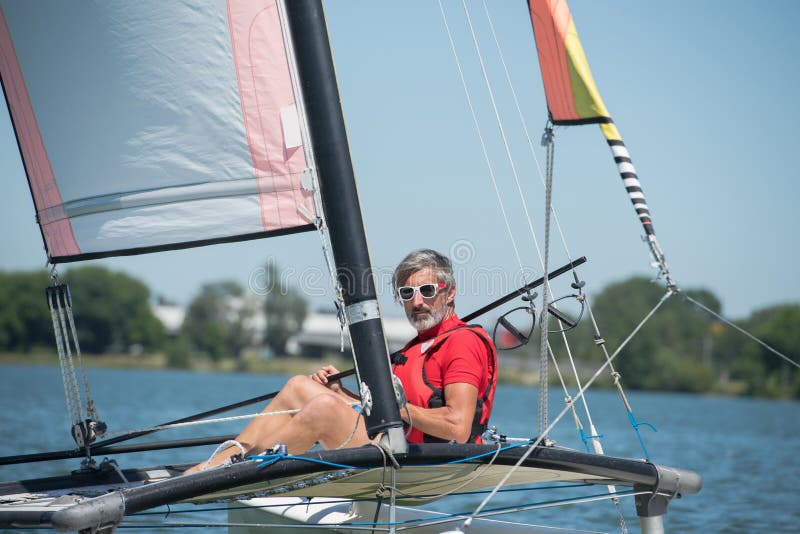 Handsome Experienced Sailor Having Fun on Lake Stock Photo - Image of ...