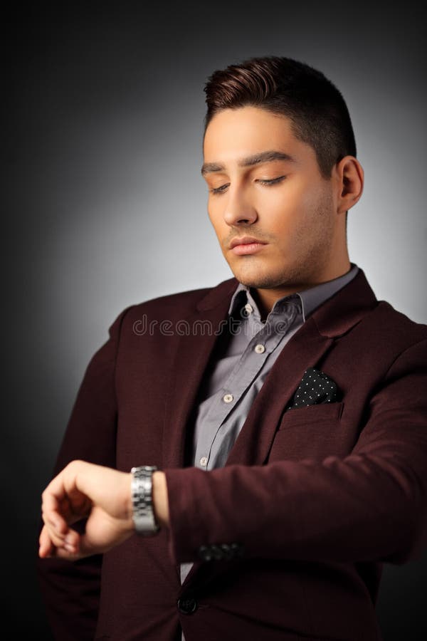 Handsome Fashionable Guy Checking The Time On His Watch Stock Photo ...