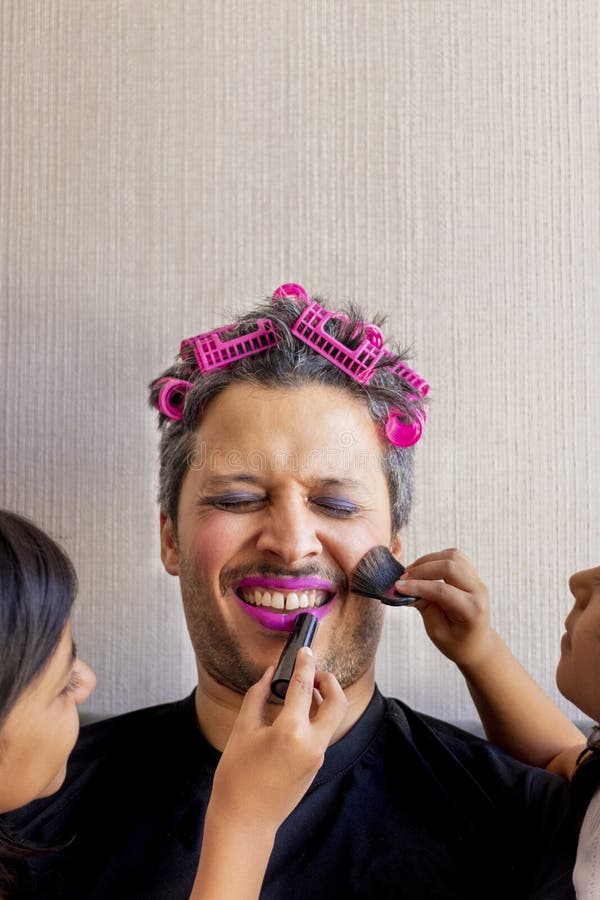 Handsome Father is Being Makeup by the Hands of His Daughters Stock ...