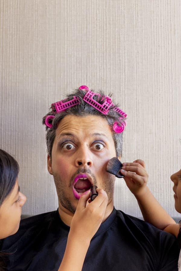 Handsome Father is Being Makeup by the Hands of His Daughters Stock ...