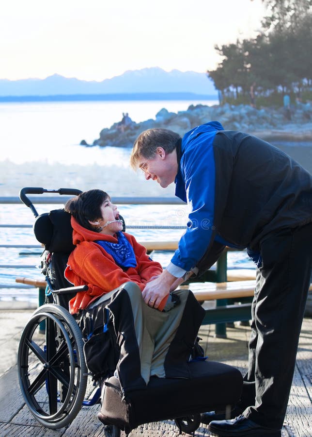 Father with His Biracial Children, Holding Disabled Son on Ferry Stock ...