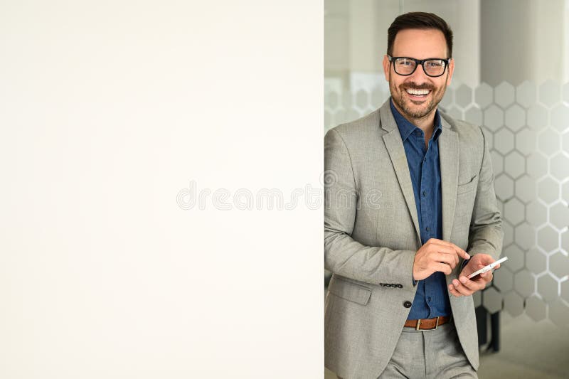 Handsome Financial Advisor Using Mobile Phone and Smiling at Camera ...