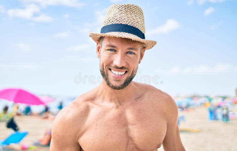 Handsome Fitness Caucasian Man At The Beach On A Sunny Day Wearing