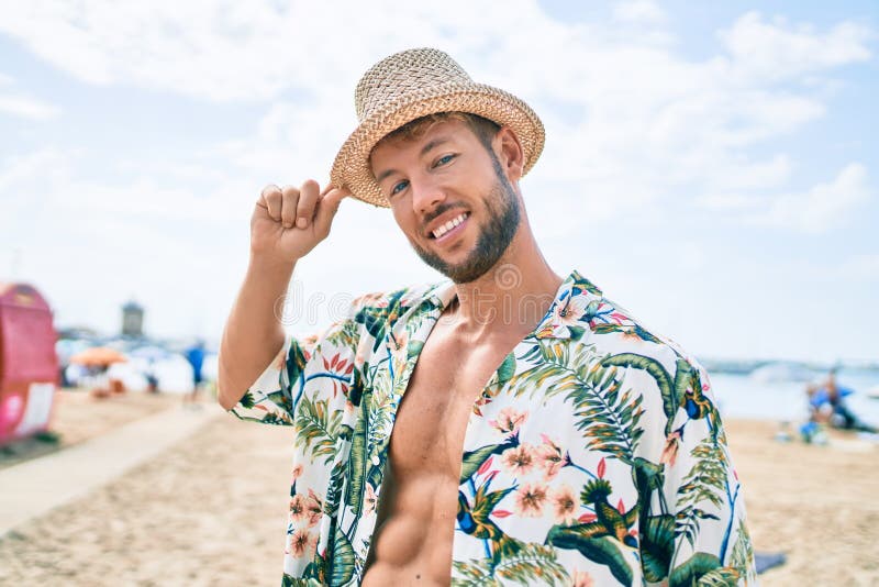 Handsome Fitness Caucasian Man At The Beach On A Sunny Day Wearing