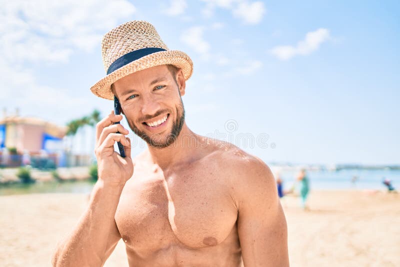 Handsome Fitness Caucasian Man At The Beach On A Sunny Day Wearing