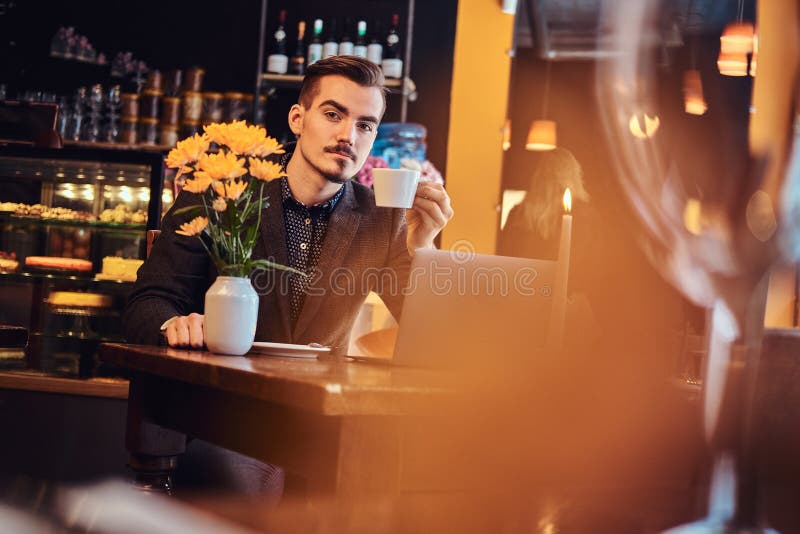 Handsome Freelancer Man With Stylish Beard And Hair Dressed In A Black