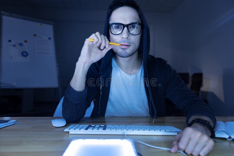 Handsome Genius Hacker Biting a Pencil Stock Image - Image of device ...