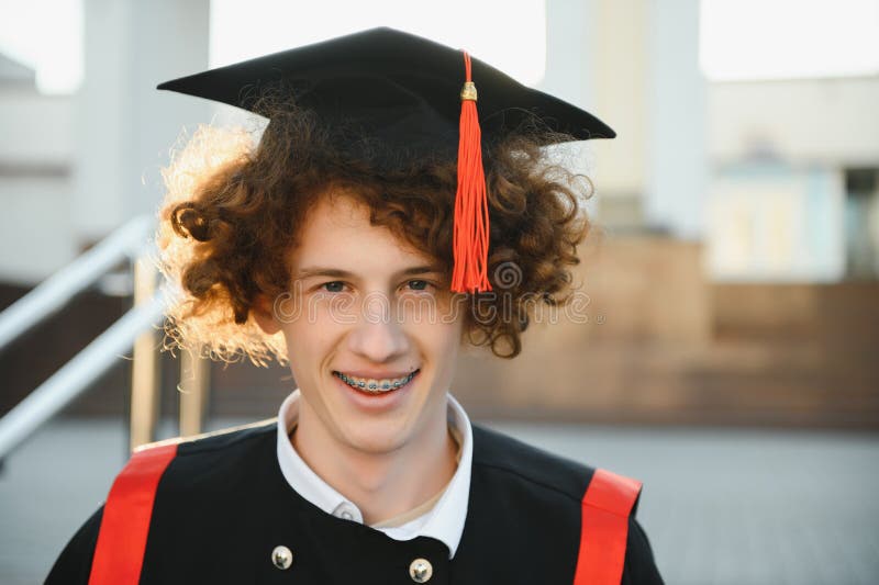Handsome Graduate in Graduation Glow with Diploma. Stock Image - Image ...