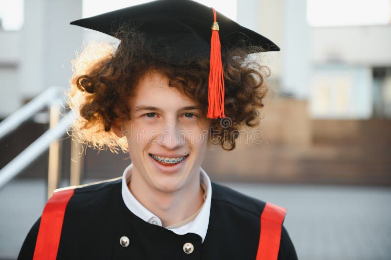 Handsome Graduate in Graduation Glow with Diploma. Stock Image - Image ...
