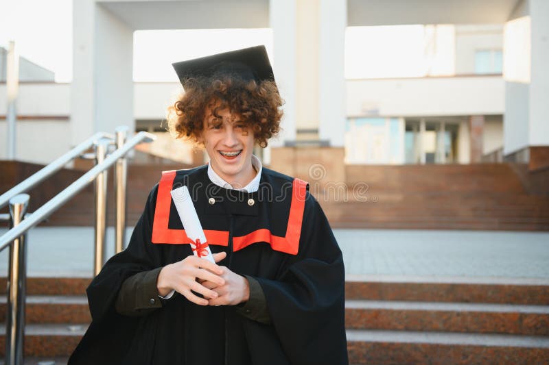 Handsome Graduate in Graduation Glow with Diploma. Stock Image - Image ...