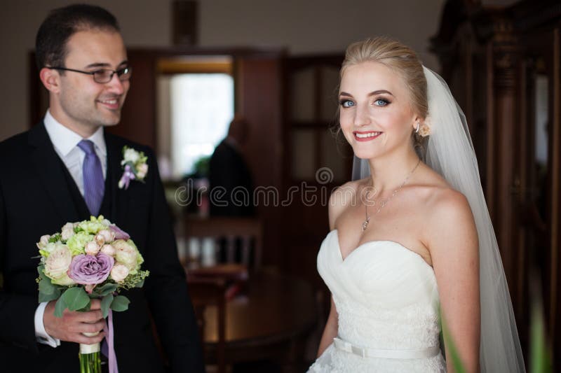Handsome Groom and Beautiful Cheerful Bride Pose with Wedding Bo Stock ...