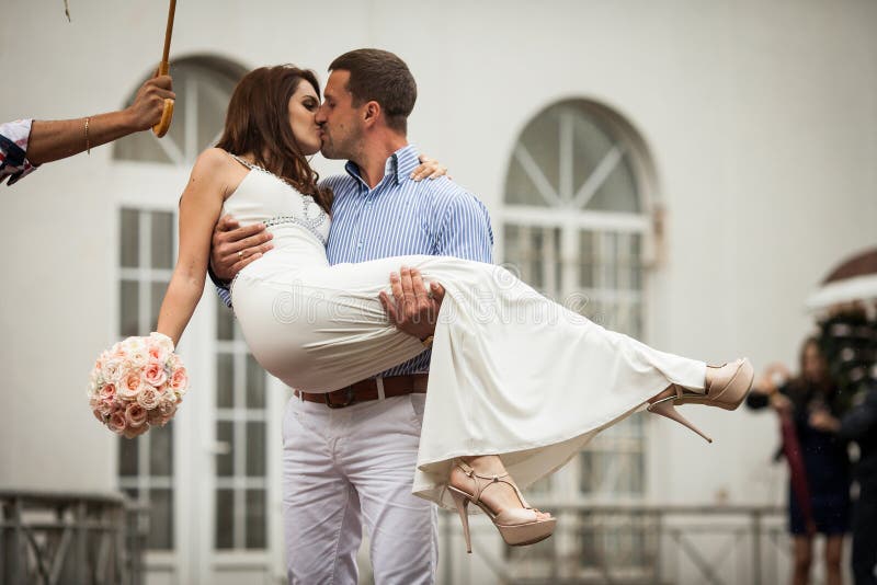 Handsome Groom Holding Beautiful Bride in His Arms Stock Image - Image ...