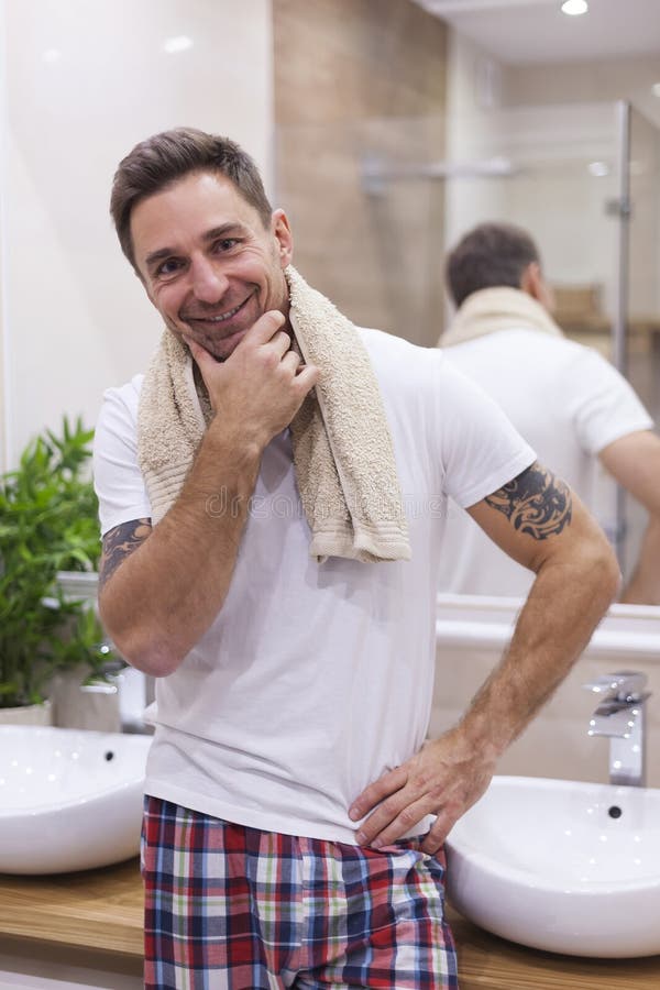 Handsome guy in bathroom stock image. Image of pajamas - 48708317