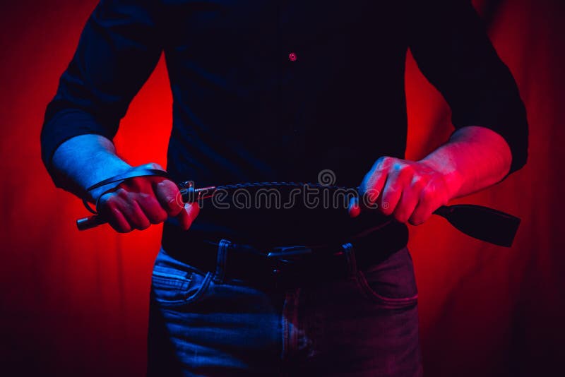 Handsome Guy with a BDSM Whip in His Hands Stock Image - Image of ...