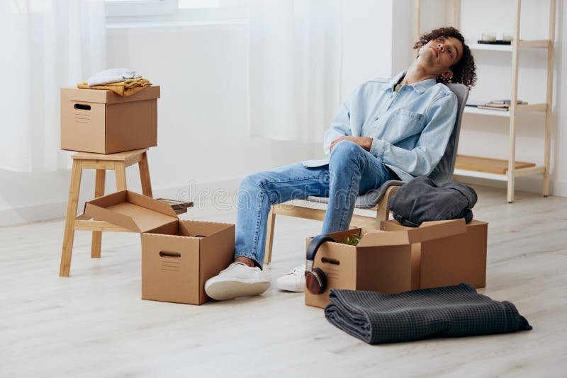 Handsome Guy Cardboard Boxes in the Room Unpacking Interior Stock Image ...