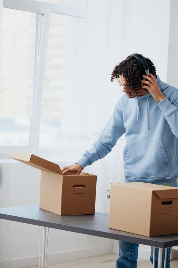 Handsome Guy Cardboard Boxes in the Room Unpacking Sorting Things Out ...
