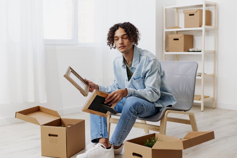 Handsome Guy Cardboard Boxes in the Room Unpacking Sorting Things Out ...