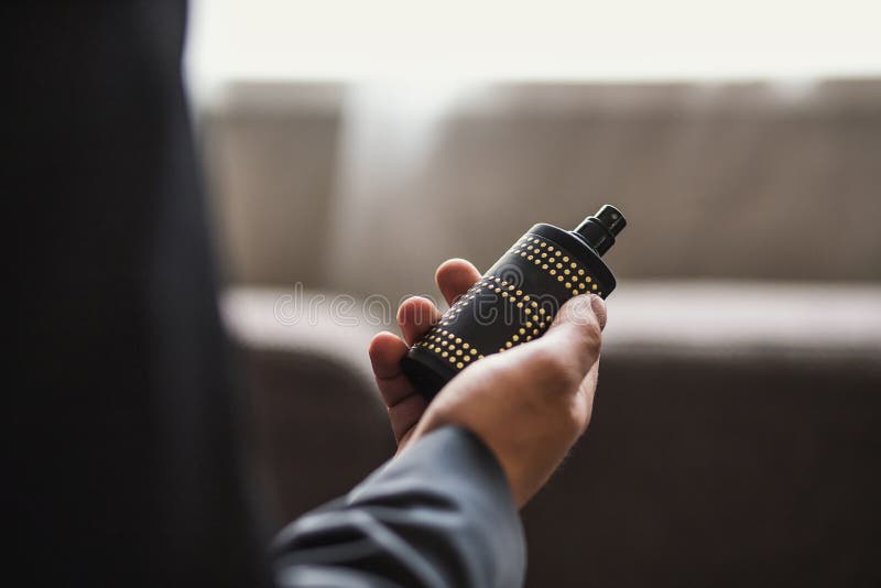 Handsome Guy is Choosing Perfumes, Elegant Man in Suit Using Col Stock ...