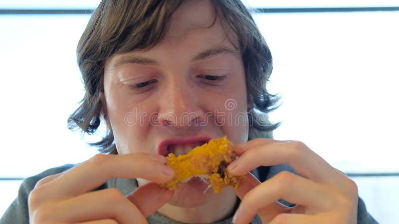 Handsome Guy Eats Chicken in Modern Fastfood Restaurant Stock Footage ...