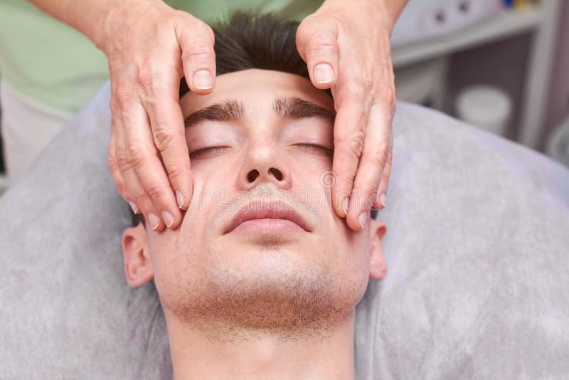 Handsome Guy, Face Massage. Stock Photo - Image of face, person: 100979574