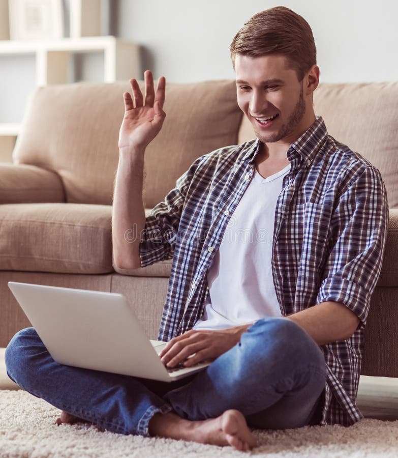 Handsome guy with gadget stock image. Image of indoors - 97181871