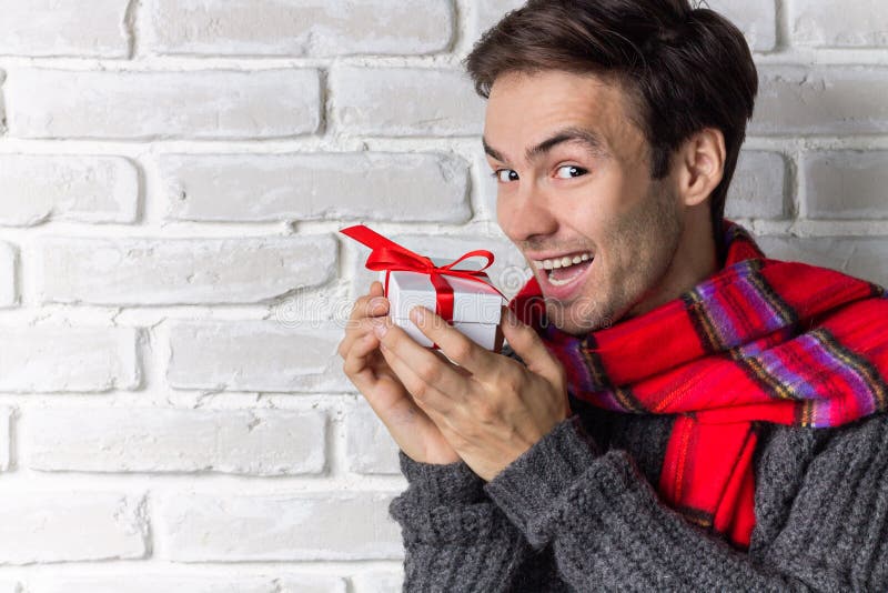 Handsome Guy Gives a Gift stock photo. Image of present - 82354234