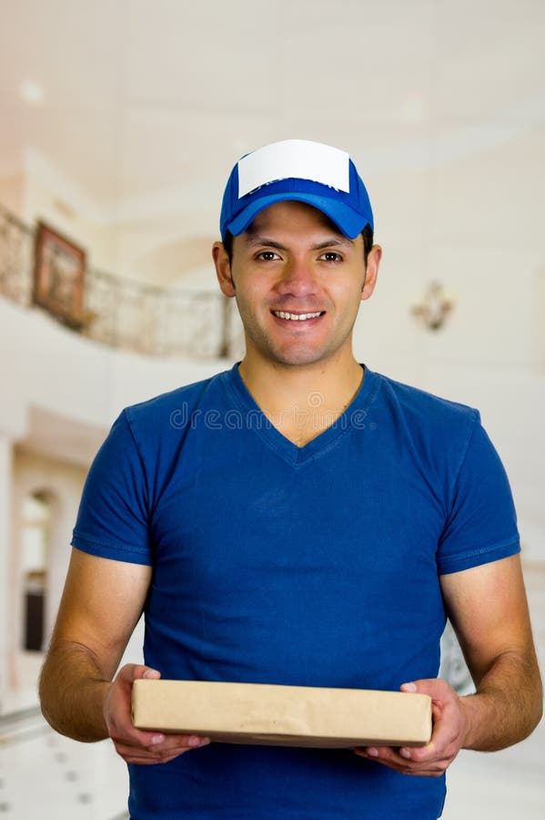 Handsome guy holding a box stock image. Image of adult - 91426271