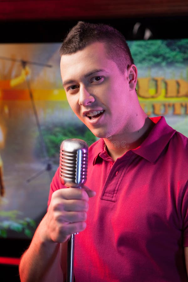 Handsome Guy Holding Mic and Singing. Stock Image - Image of head, hand ...