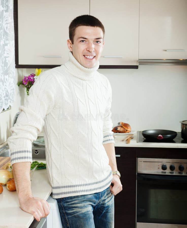 Handsome guy at kitchen stock image. Image of works, working - 37004627