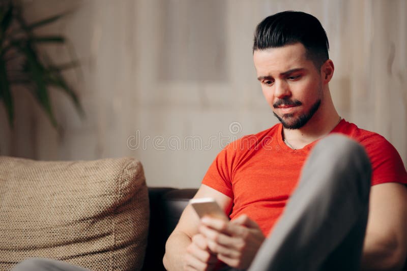 Man Reading Text Messages on His Smartphone Stock Photo - Image of ...