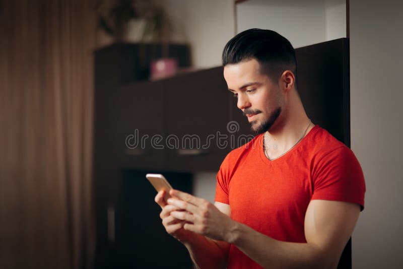 Man Reading Text Messages on His Smartphone Stock Photo - Image of ...