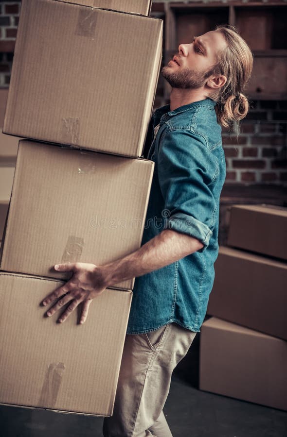 Handsome guy moving stock image. Image of apartment, hair - 98631991