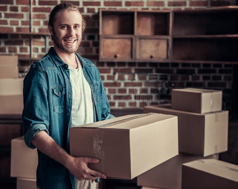 Handsome guy moving stock image. Image of life, property - 98631987