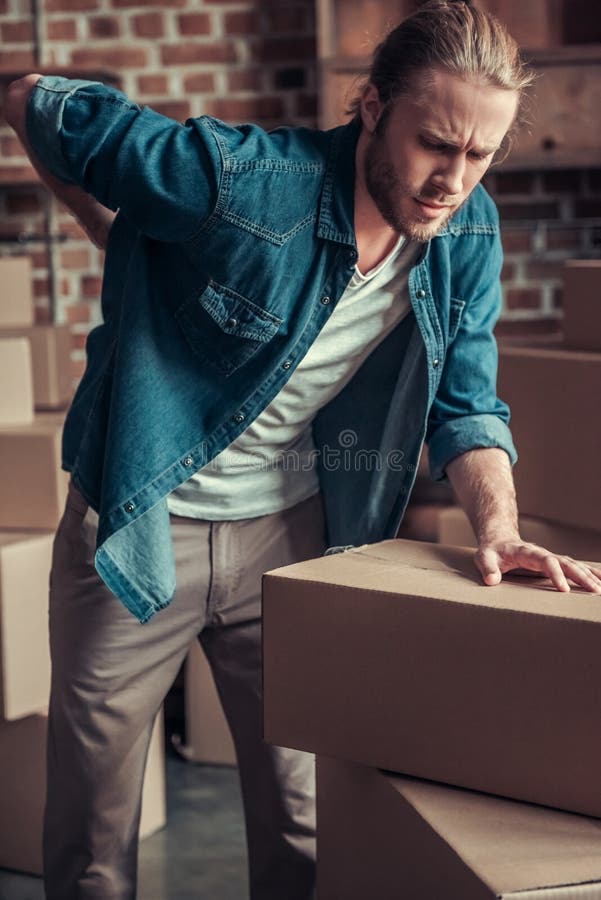 Handsome guy moving stock photo. Image of packing, happy - 98632108