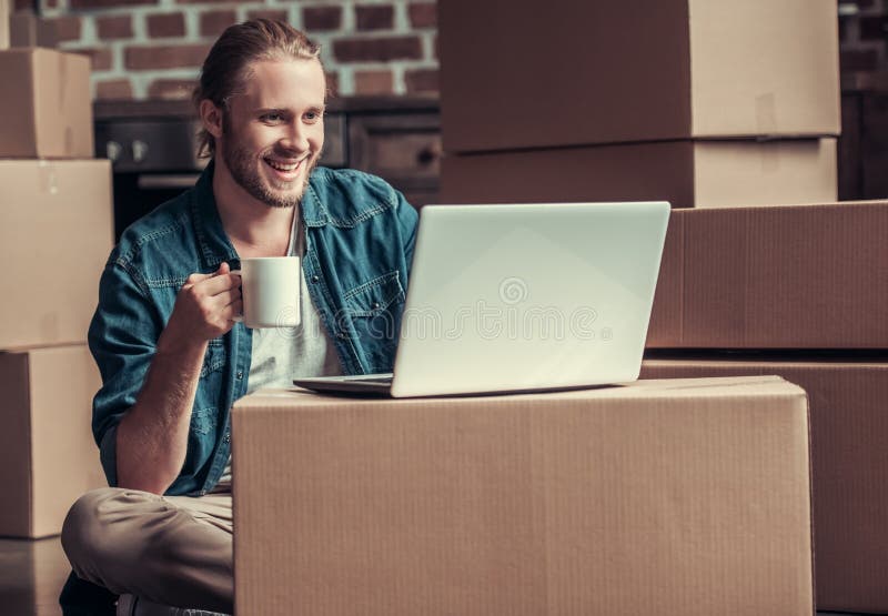 Handsome guy moving stock photo. Image of handsome, gadget - 98632134